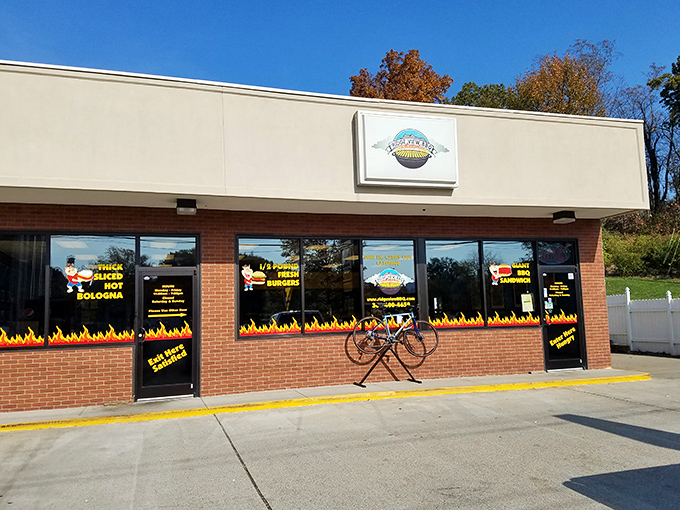 The unassuming storefront with its flame-decorated windows is like a beacon to barbecue pilgrims. Smoke signals that say "come hungry, leave happy."