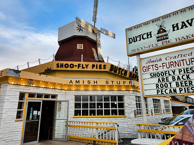 The iconic windmill atop Dutch Haven stands like a lighthouse for dessert lovers, guiding hungry travelers to pie paradise on Route 30.