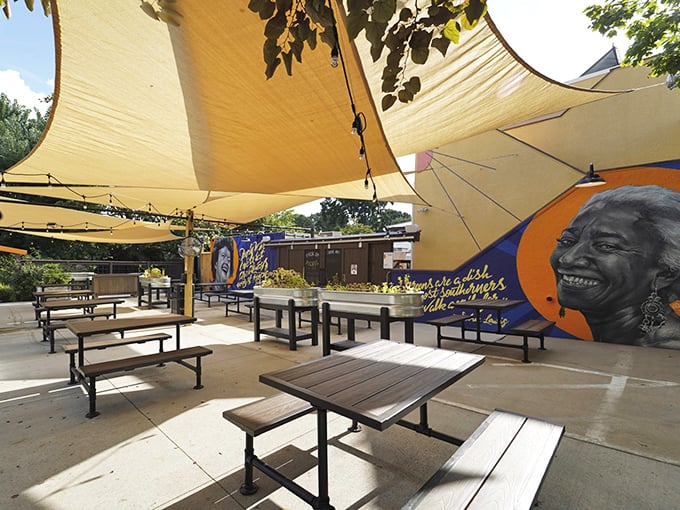 The cheerful yellow exterior of Sunny Point Cafe stands like a beacon of breakfast hope on West Asheville's bustling corridor.