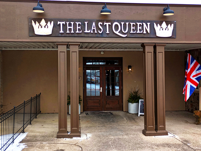The Last Queen stands proudly in Enon, its stone facade and British flag promising an authentic pub experience that feels worlds away from Ohio cornfields.