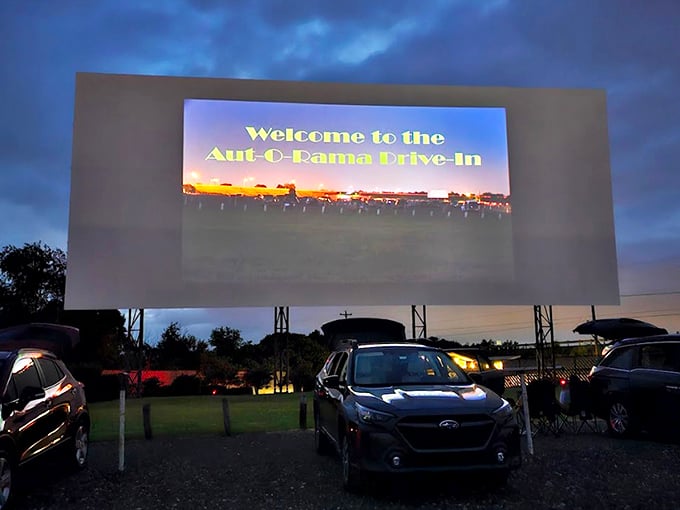 Twilight magic unfolds as cars gather beneath the massive screen, nature providing the perfect backdrop for cinema under an Ohio sunset.