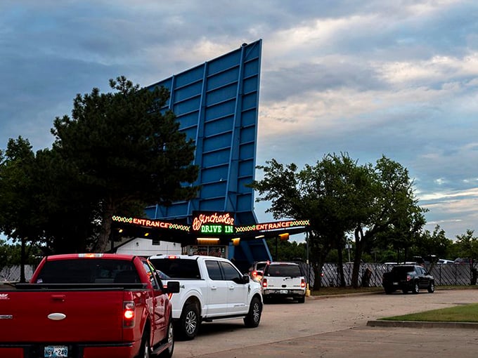 Sunset magic at the Winchester Drive-In, where vintage trucks and modern sedans share the same timeless experience under Oklahoma's painted sky.