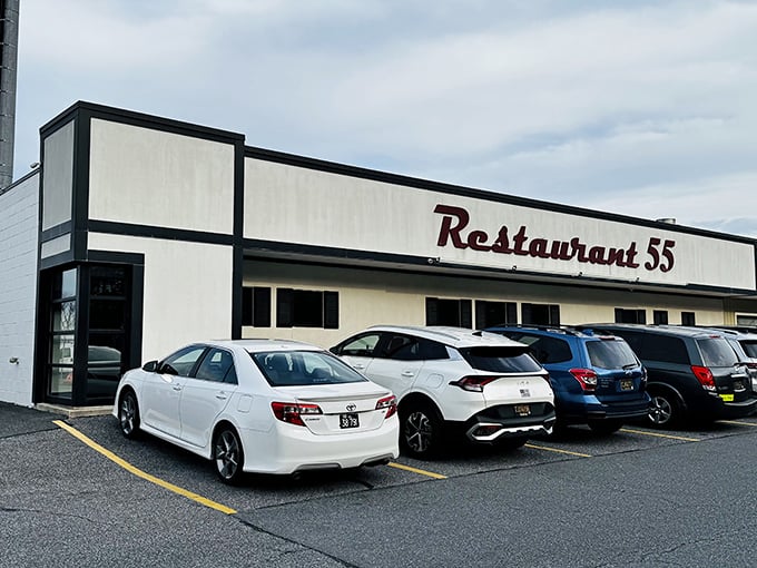 The classic red script signage welcomes you like an old friend. That vintage Mercedes in the parking lot suggests you're not the only one with good taste.