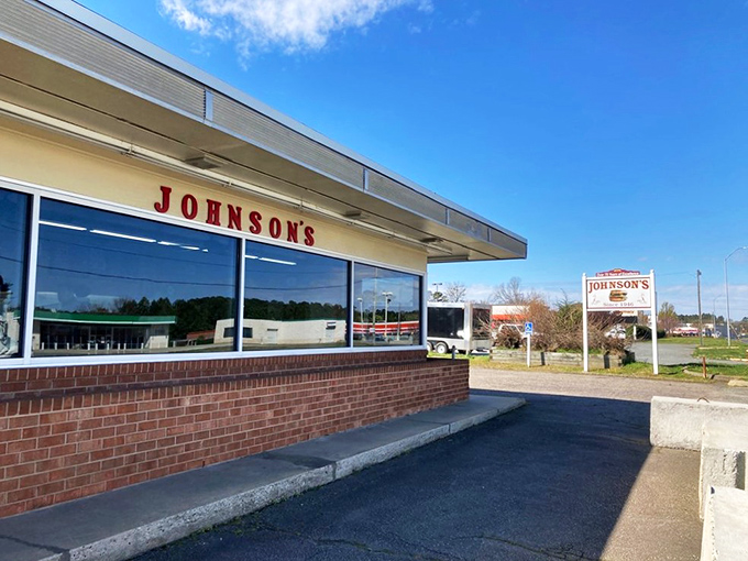 The unassuming exterior of Johnson's Drive-In has welcomed burger enthusiasts since 1946, proving that culinary landmarks don't need flashy facades to become legendary. 