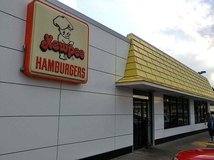 The unassuming white building with its cheerful yellow roof houses burger magic that's been drawing pilgrims to Lima for generations.