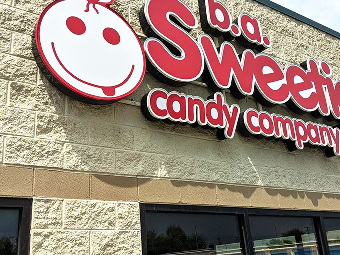 That iconic red signage against the cream-colored building is like a beacon for your inner child. Sweeties Candy Company stands ready to fulfill sugar-coated dreams.