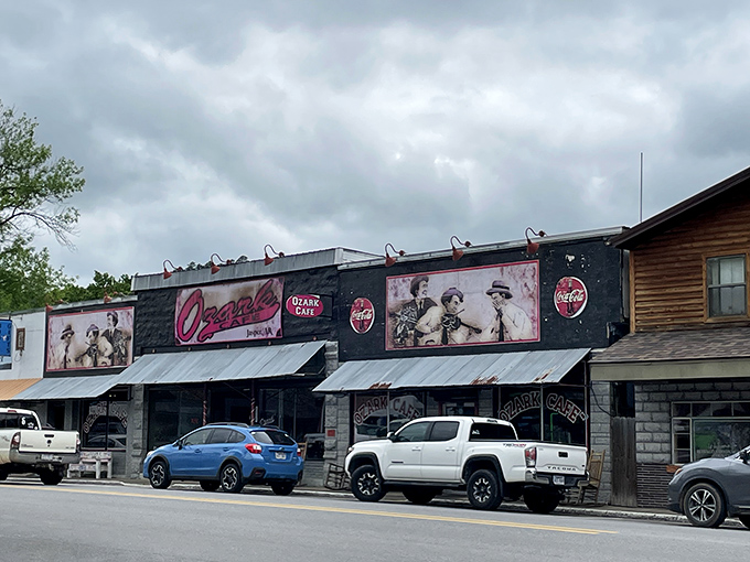 The black facade of Ozark Cafe stands proudly on Jasper's main street, vintage photos and that classic Coca-Cola signage promising authentic Arkansas comfort within.