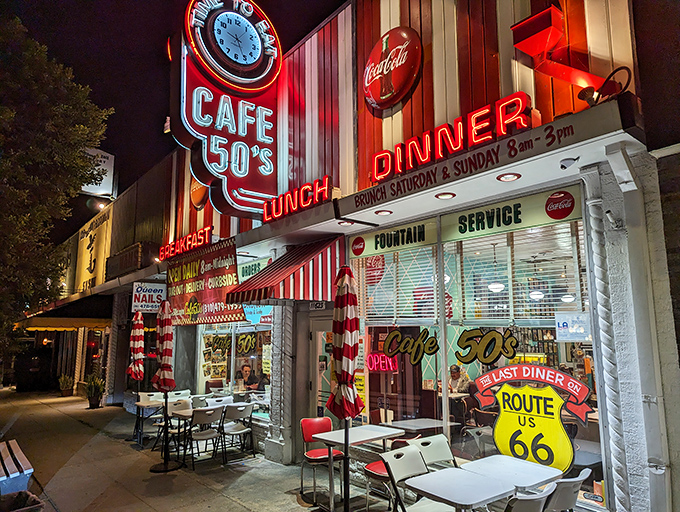 The neon glow of Cafe 50's beckons like a time machine disguised as a diner. Route 66 nostalgia never tasted so good.