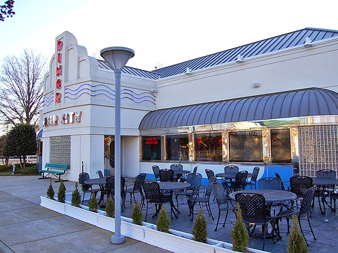 Art deco meets comfort food heaven in this retro-styled exterior. The blue awnings and vintage signage promise a time-traveling culinary adventure.