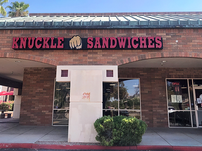 The "NOW OPEN!" banner might be outdated, but the promise of what awaits behind those brick walls is eternally fresh. A sandwich sanctuary beckons.