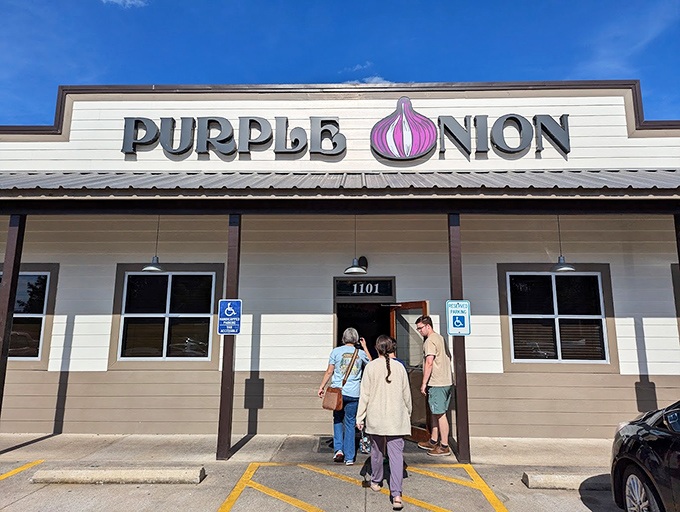 The Purple Onion's exterior beckons with its playful signage &ndash; that giant purple bulb is basically saying, "Good food happens here, folks!"