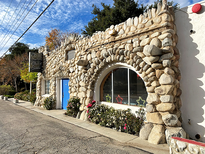 Stone by stone, this fairy tale fa&ccedil;ade promises culinary magic within. The blue door isn't just an entrance&mdash;it's a portal to France itself.