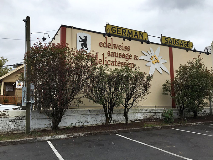 The iconic cream-colored exterior of Edelweiss, with its charming alpine flower logo, stands as Portland's beacon of German culinary tradition. 