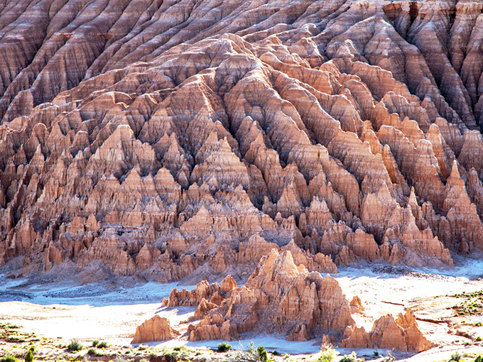 Nature's skyscraper stands proudly against Nevada's impossibly blue sky. This towering spire is what geological patience looks like after a few million years.
