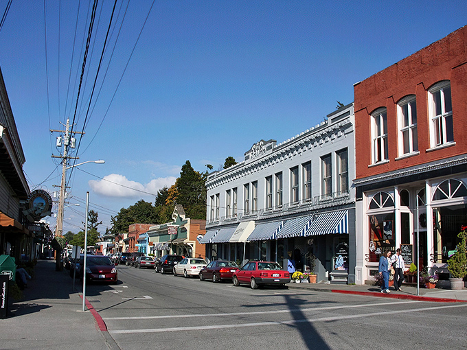 First Street's historic buildings house the heartbeat of La Conner, where seafood dreams and shopping addictions coexist in perfect harmony.