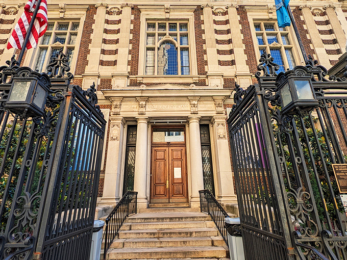 The iconic blue sign welcomes curious minds to Philadelphia's temple of medical marvels, standing bright against the city skyline like a beacon for the wonderfully weird. 