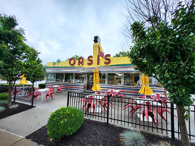 The gleaming yellow exterior of Oasis Diner stands as a sunshine-colored time portal on Plainfield's Main Street, where mid-century dreams are served daily.