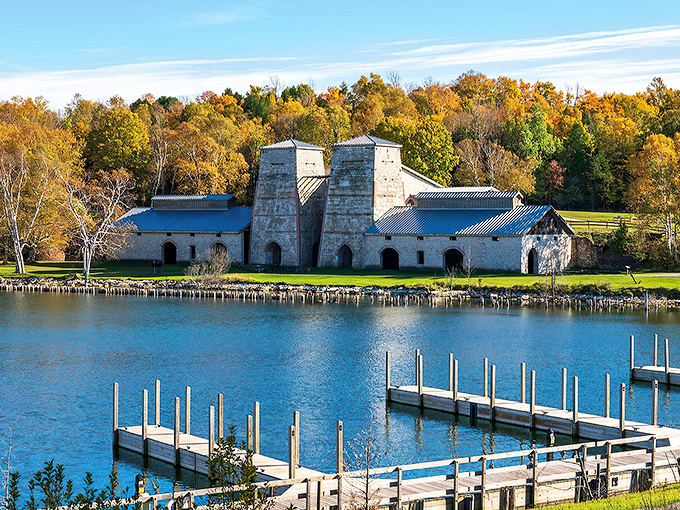 The imposing limestone blast furnaces stand like ancient temples against the azure waters of Snail Shell Harbor, a perfect marriage of industrial history and natural beauty.