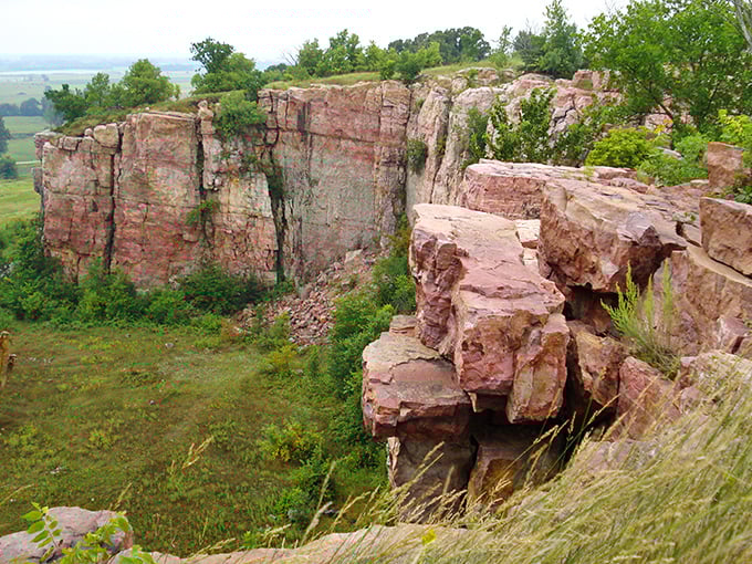 The dramatic quartzite cliffs of Blue Mounds rise like nature's skyscrapers from the prairie, a geological marvel that would make the Grand Canyon blush with envy.
