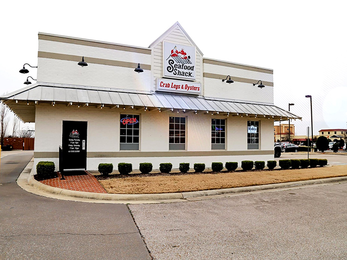 The Seafood Shack's inviting exterior promises maritime delights in landlocked Arkansas. String lights and outdoor seating beckon hungry travelers like a lighthouse for seafood lovers.