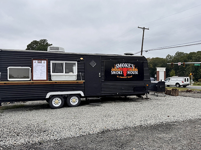 The black trailer with flames on the logo isn't just a food truck&mdash;it's a smoke-signaling beacon for BBQ pilgrims across Delaware.
