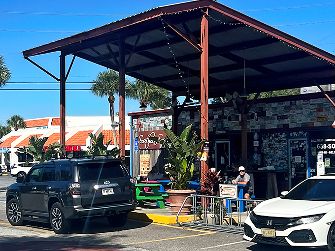 The converted gas station sanctuary where smoke signals beckon hungry pilgrims from miles around. Georgia's coastal barbecue haven awaits beneath that humble wooden awning.