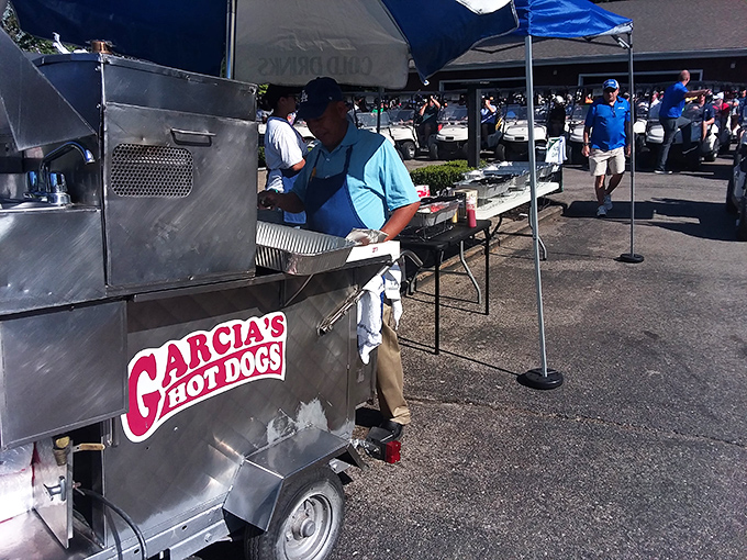 The outdoor setup at Garcia's proves the best culinary experiences don't need fancy tablecloths—just a tent, a grill, and people who know what they're doing.