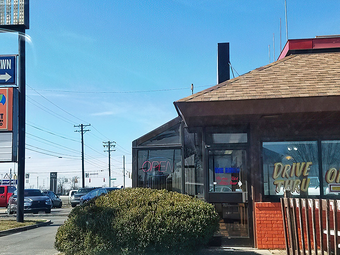 The unassuming exterior of The Patio stands like a beacon of hope for hot dog enthusiasts, its orange-trimmed patio promising simple pleasures in a complicated world.