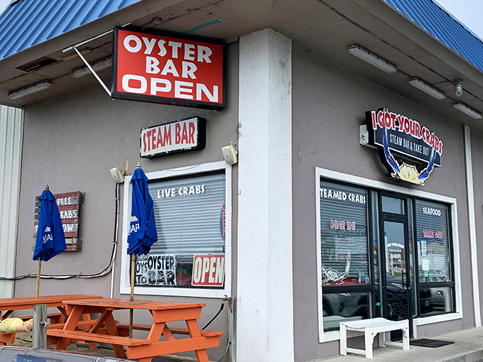 The unassuming exterior hides seafood greatness within, like finding a pearl in the most ordinary-looking oyster. Blue signage beckons hungry travelers.