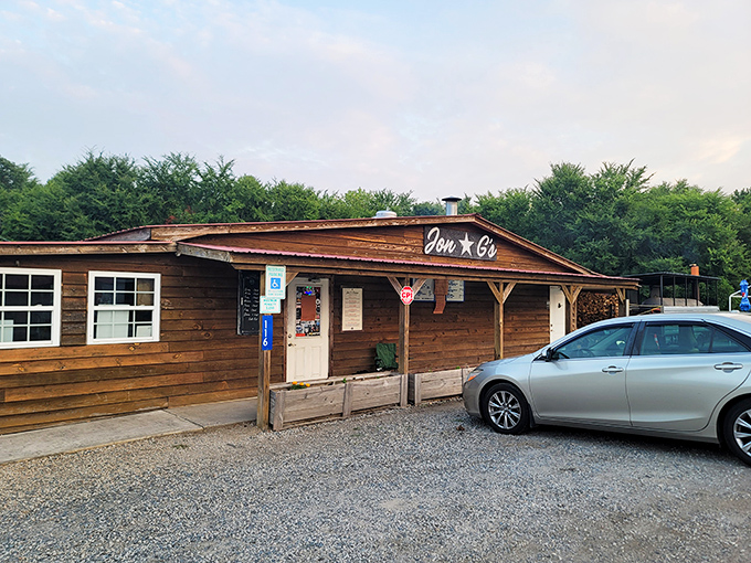 The line forms early at Jon G's rustic wooden facade, where BBQ pilgrims gather with the reverence of concert-goers awaiting a legendary headliner.