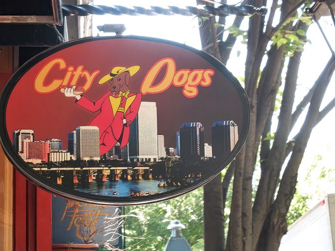 The cheerful red brick and bright yellow awning of City Dogs beckons hungry passersby like a lighthouse for the gastronomically adrift.