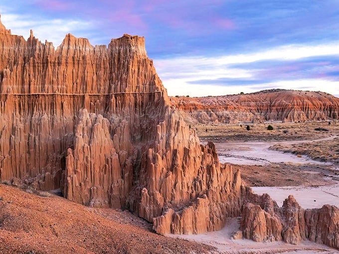 Nature's skyscraper stands proudly against Nevada's impossibly blue sky. This towering spire is what geological patience looks like after a few million years.