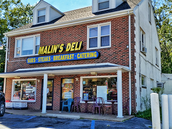 The unassuming brick facade of Malin's Deli stands like a sandwich sentinel in Newark, promising delicious treasures within for those wise enough to stop.