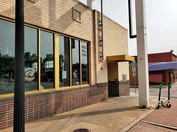 The unassuming brick exterior of Hurts Donut Company hides a kaleidoscope of sugary treasures within. Yellow trim hints at the colorful experience awaiting inside.