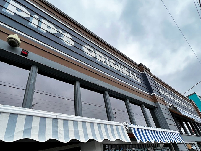 The modest blue-striped awning and understated storefront of Pip's Original might fool you, but locals know better than to judge this donut destination by its cover.