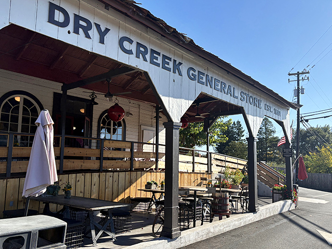 The white clapboard facade of Dry Creek General Store stands proudly against the California sky, a time capsule from 1881 that's still very much alive and kicking.