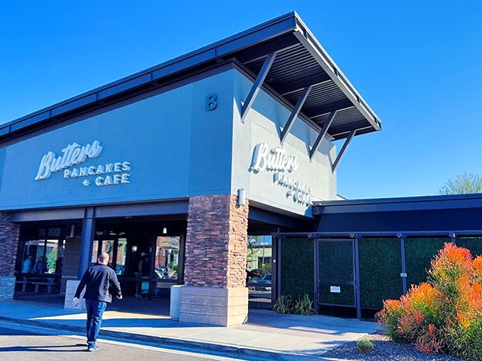 The stone-accented facade of Butters Pancakes & Cafe doesn't just welcome you&mdash;it practically issues a breakfast challenge to the line of eager patrons.