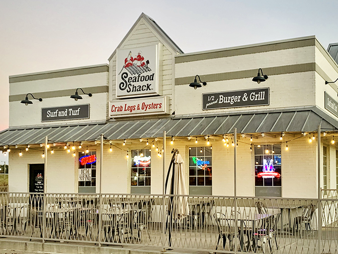 The Seafood Shack's inviting exterior promises maritime delights in landlocked Arkansas. String lights and outdoor seating beckon hungry travelers like a lighthouse for seafood lovers.
