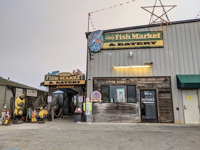 The unassuming blue exterior of Phil's Fish Market & Eatery stands like a salty sea captain &ndash; weathered, unpretentious, and hiding treasures within.