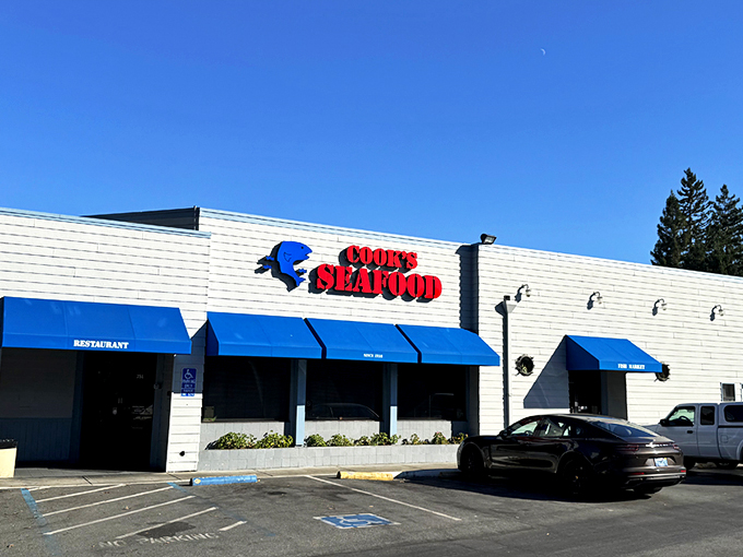 The unassuming blue-awninged exterior of Cook's Seafood stands as a beacon to seafood lovers, proving that culinary treasures often hide in plain sight.
