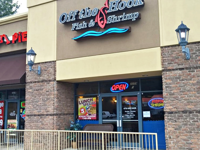 The neon glow of Off The Hook beckons like a lighthouse for the seafood-starved, promising fried treasures within its unassuming brick walls.