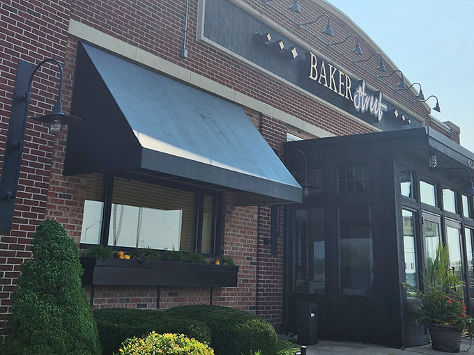 The brick exterior of BakerStreet Steakhouse stands like a confident understatement&mdash;promising excellence without shouting about it. Those flower boxes aren't just pretty; they're a preview of the attention to detail waiting inside.