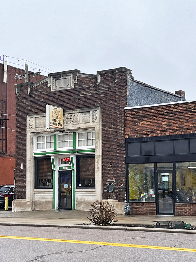 The historic brick building housing Bradley's Corner Cafe stands proudly in North Topeka, its green-trimmed entrance beckoning hungry patrons like a culinary lighthouse.