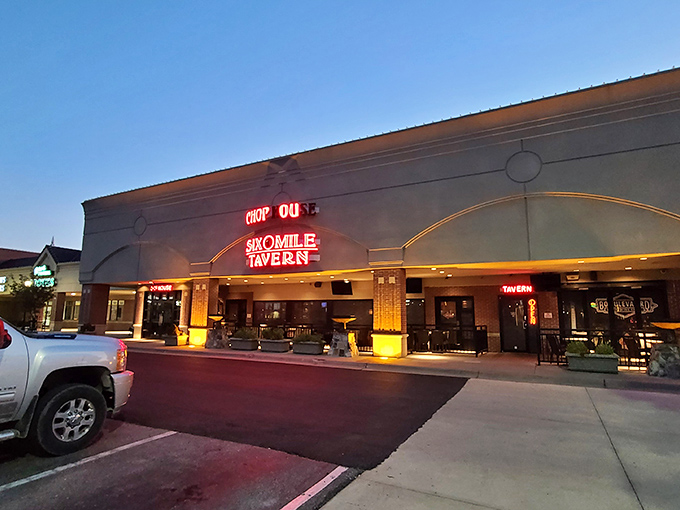 The unassuming exterior of Six Mile Chop House belies the carnivorous paradise within. Red neon beckons hungry Kansans like a lighthouse for the beef-obsessed.