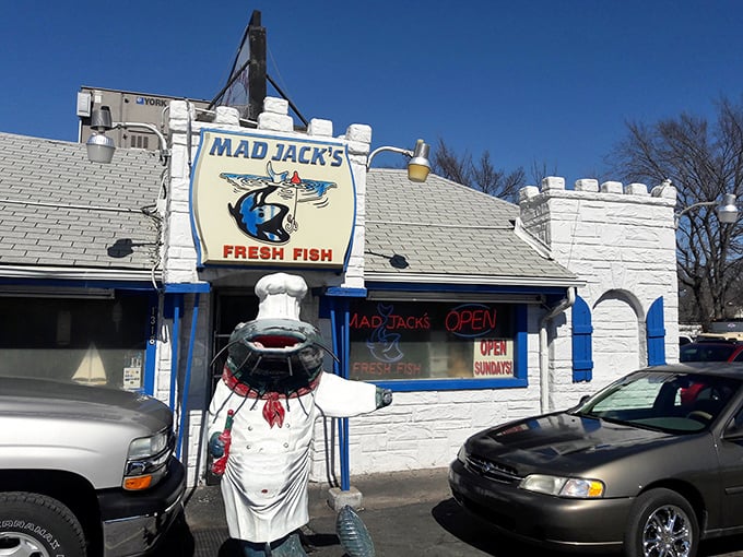 The castle-like exterior of Mad Jack's Fresh Fish stands as a blue-trimmed beacon of seafood hope in landlocked Kansas City.