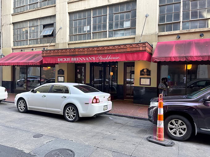 The unassuming red awning of Dickie Brennan's Steakhouse beckons from the historic French Quarter, promising culinary treasures that outshine its modest exterior.