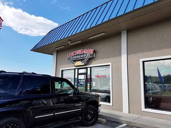 The unassuming exterior hides seafood greatness within, like finding a pearl in the most ordinary-looking oyster. Blue signage beckons hungry travelers.
