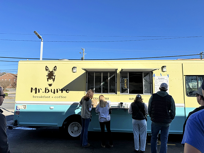 The mint-blue and cream-colored Mr. Burro food truck stands ready to serve, its donkey logo promising stubborn dedication to breakfast perfection. 