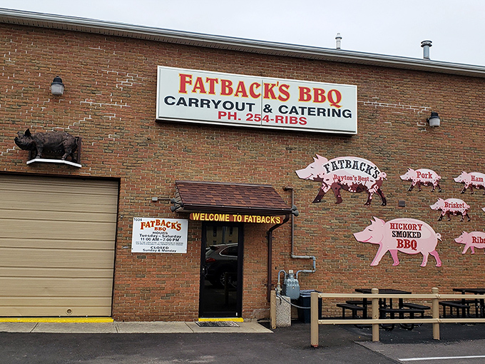 The pink pig silhouettes on Fatback's brick exterior aren't just decoration&mdash;they're a roadmap to flavor paradise. Welcome to pork heaven!