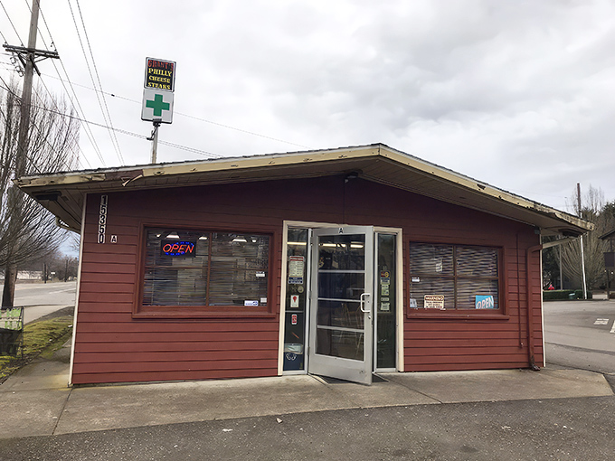 The unassuming burgundy exterior of Grant's might not scream "food destination," but that neon "OPEN" sign is your gateway to cheesesteak paradise.